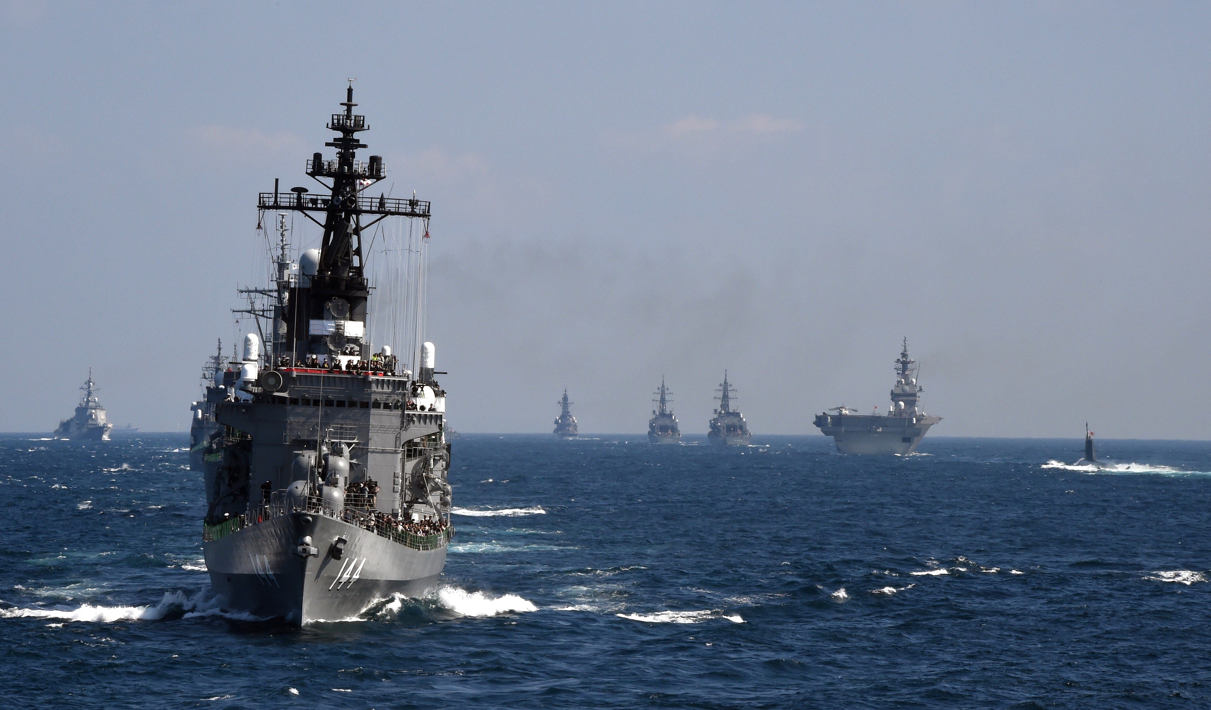 Japan's Maritime Self-Defense Force (MSDF) escort ship Kurama (L) sails ...